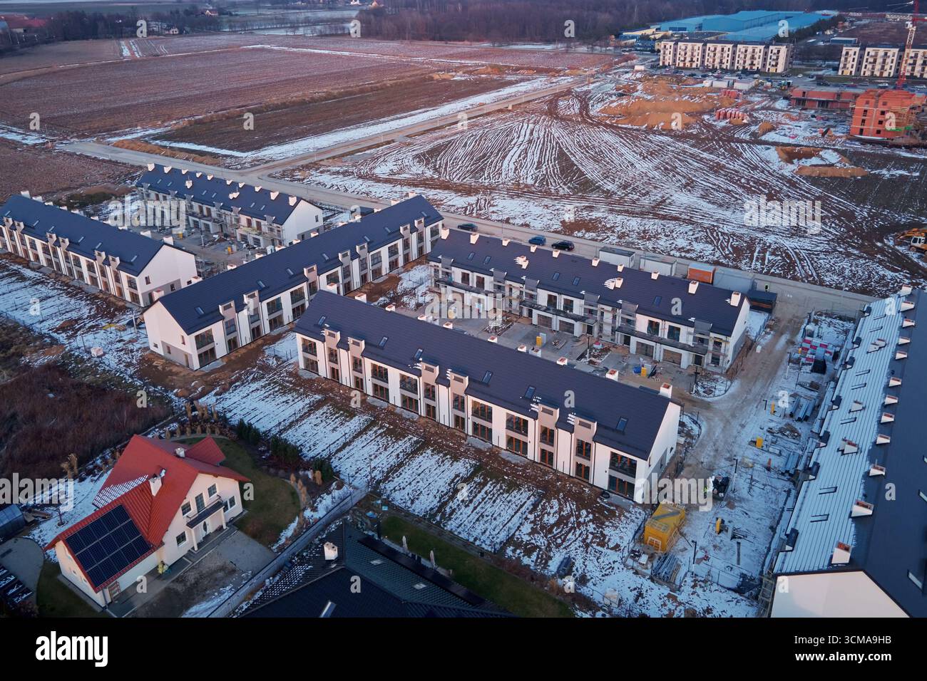 Drone view of new residential housing estate under construction in ...