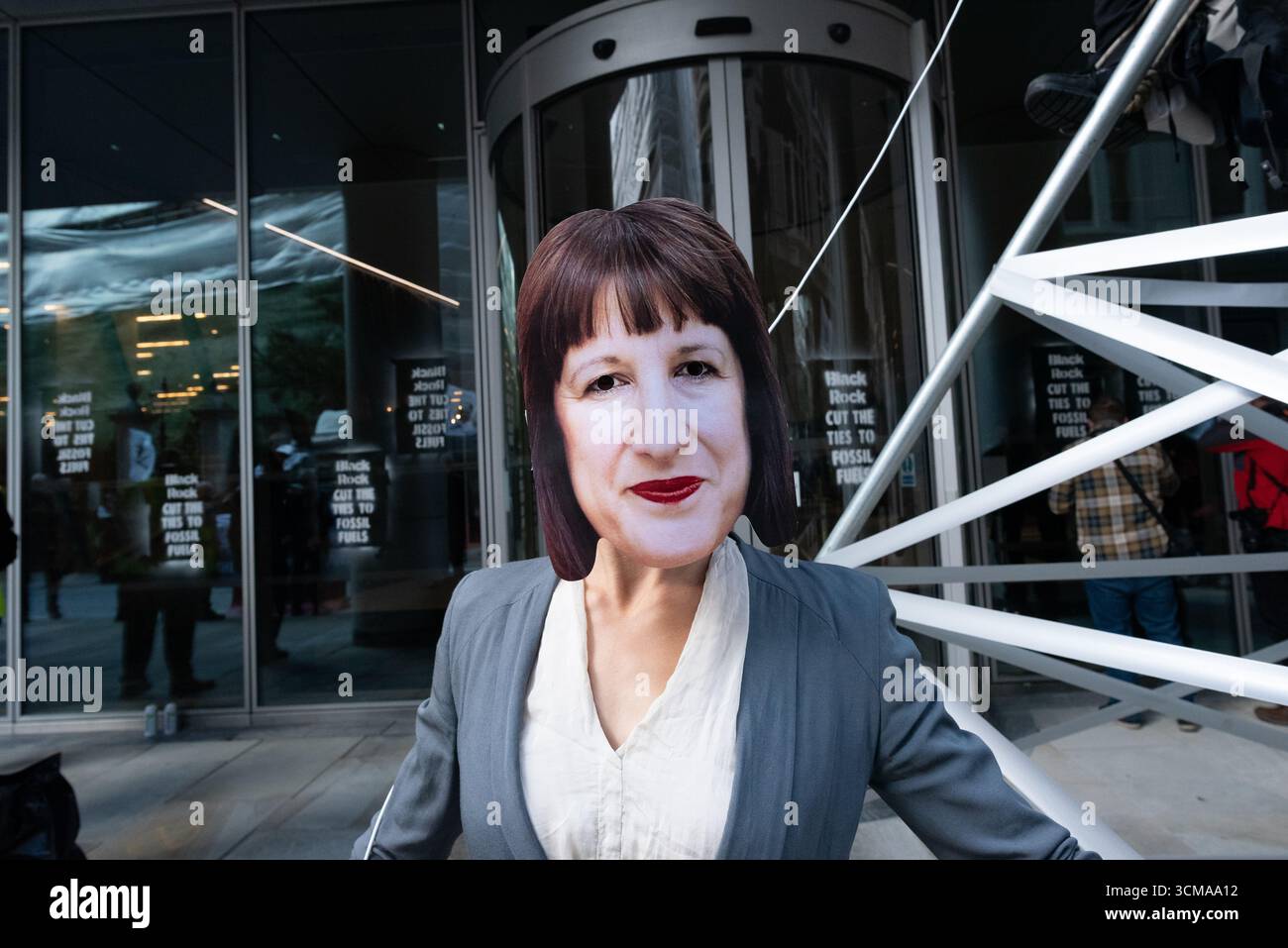 London, UK. 15 September, 2025. A protester wears a mask depicting ...