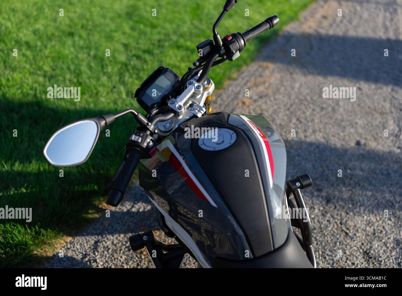 Close-up, top-down view of a sport motorcycle's handlebars, dashboard ...