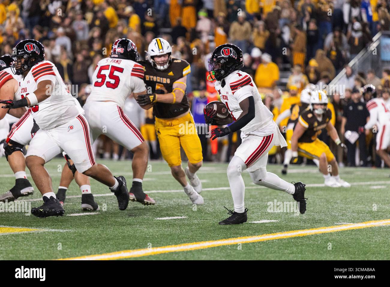 Utah running back Wayshawn Parker (1) runs ball the during the first half of an NCAA college ...