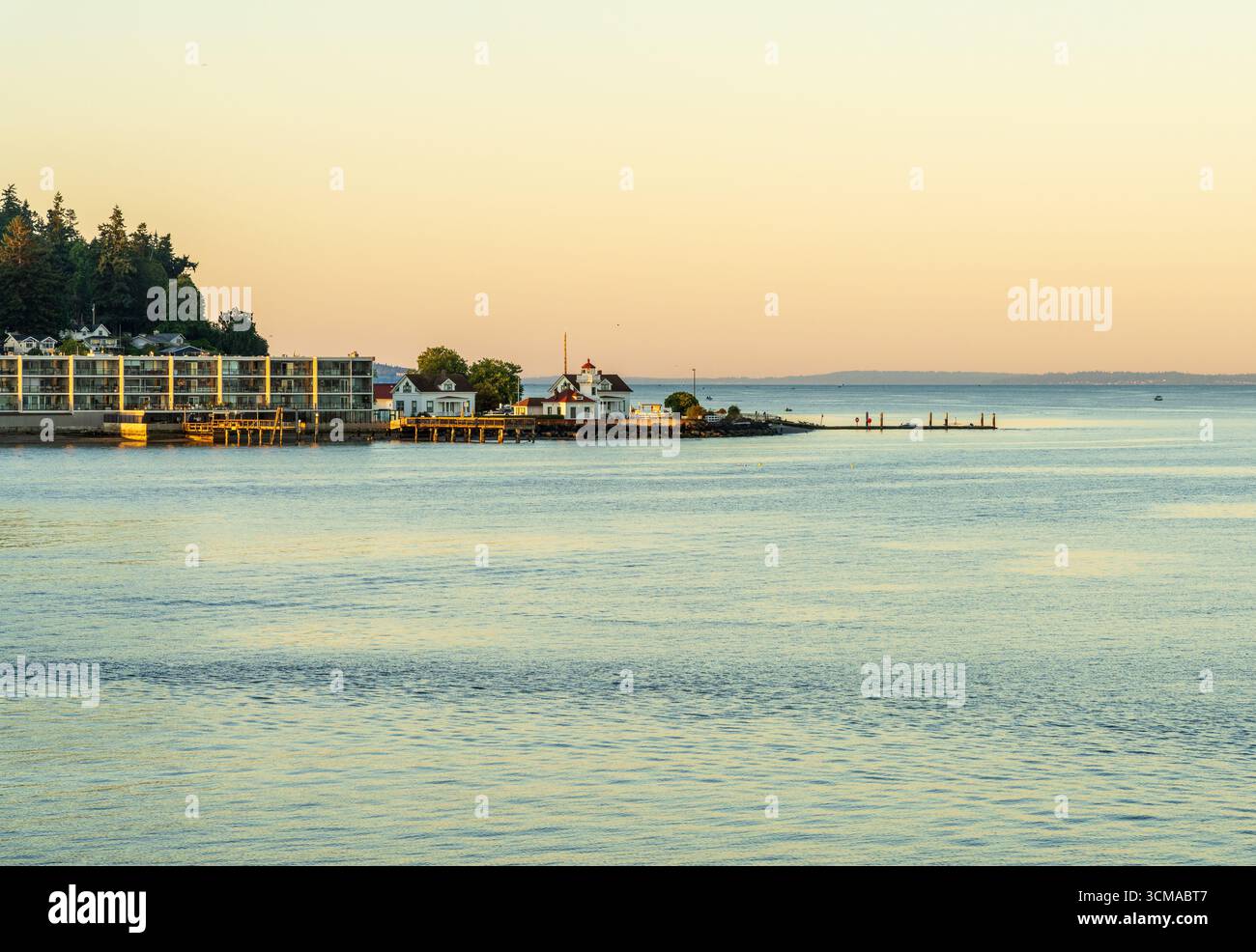 Early morning sun lights Lighthouse Park in Mukilteo in Washington ...
