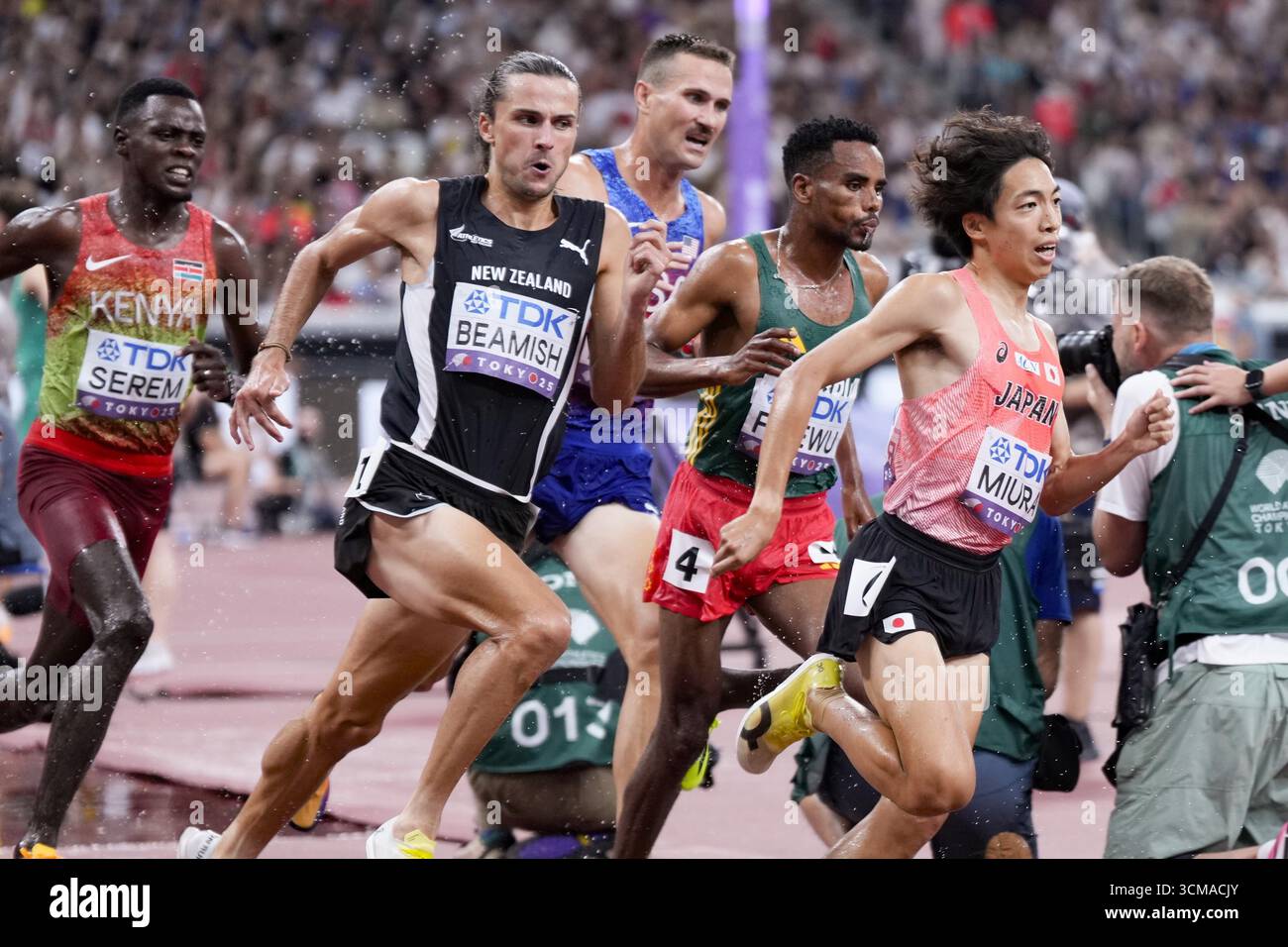 Athletes compete in the men's 3,000-meter steeplechase final at the ...