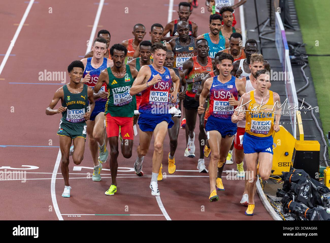 Nico Young (USA) and Grant Fisher (USA) run toward the front of the ...