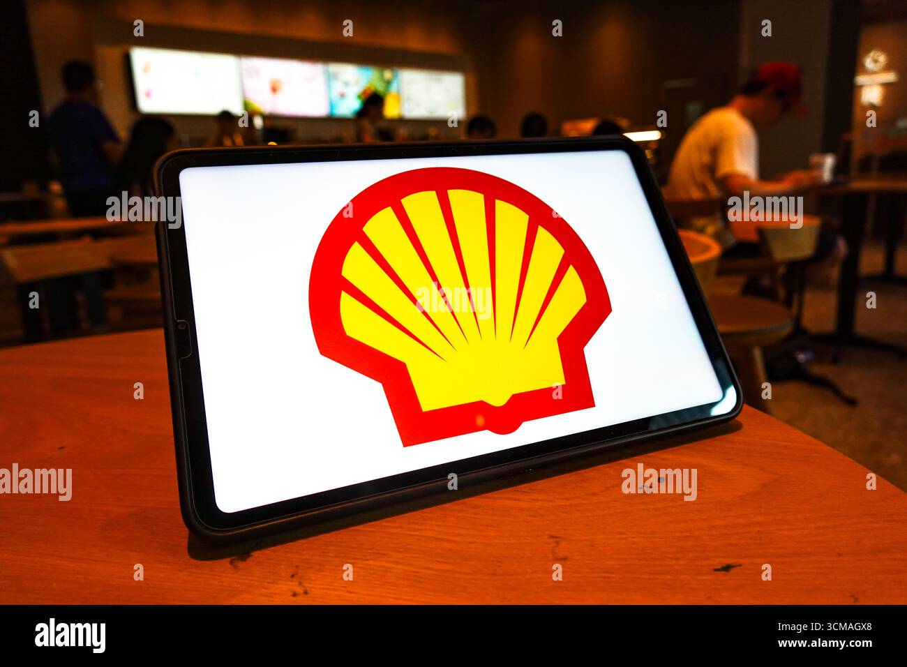 In this photo illustration, the logo of Shell is displayed on the ...