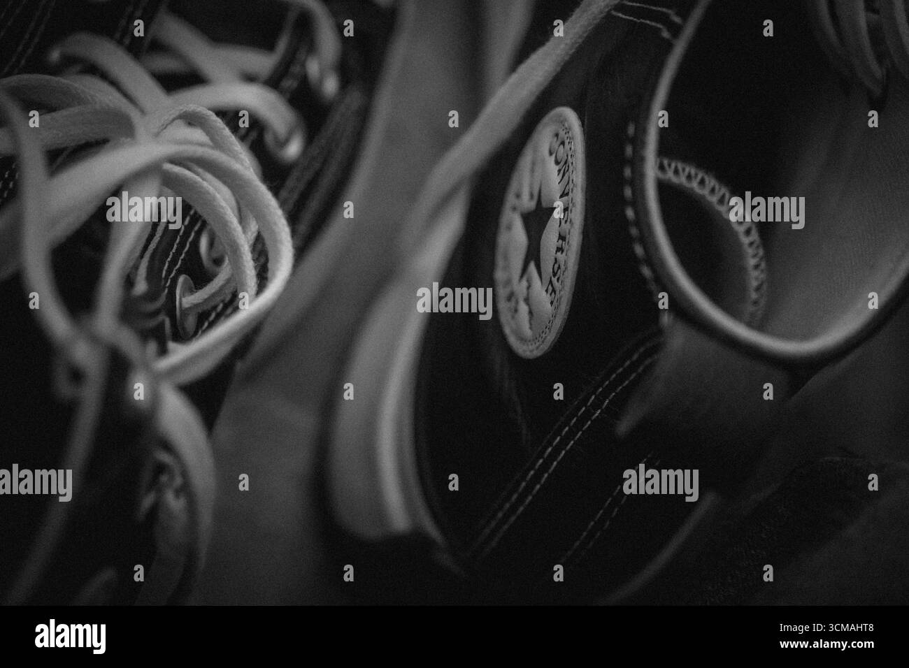 Black and white photo of Converse All Star sneakers on the ground Stock ...