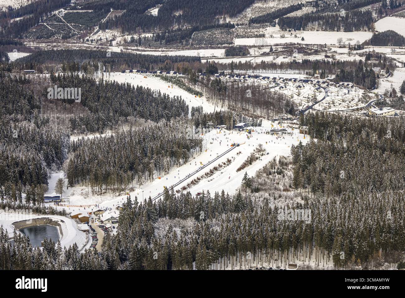 Aerial view ski slopes and skiers, conveyor belt, winter wonderland in ...