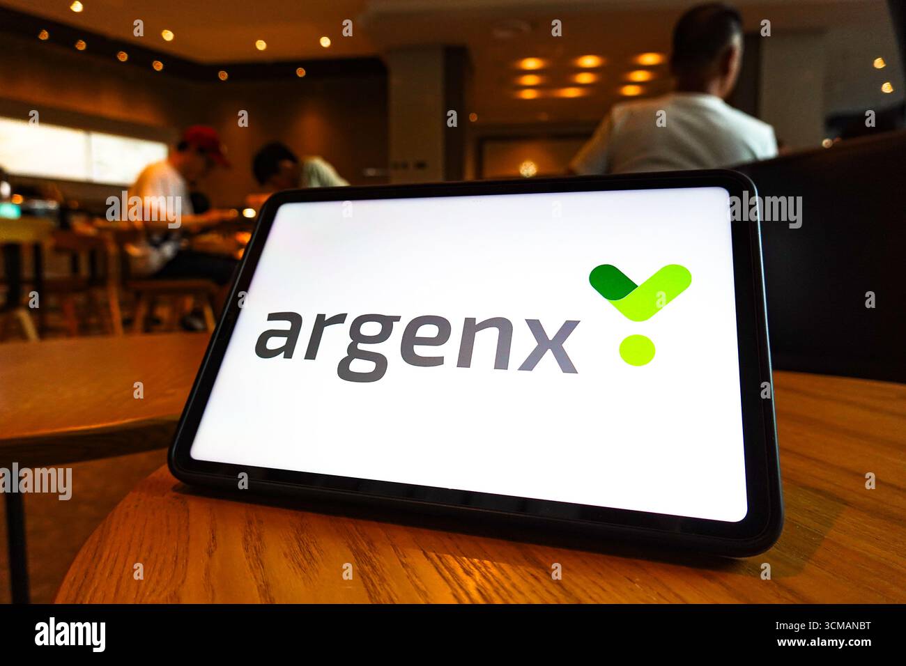 In this photo illustration, the logo of argenx is displayed on the ...