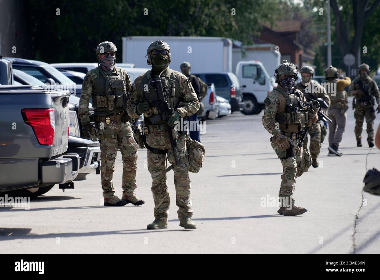 Federal agents stand guard as a planned protest starts outside of an ...