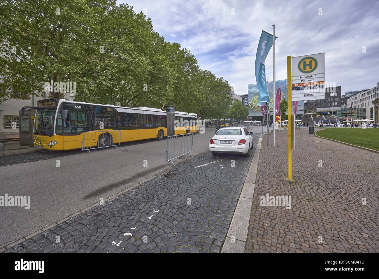 City centre, bus stop Schlossplatz, street, pavement made of ...