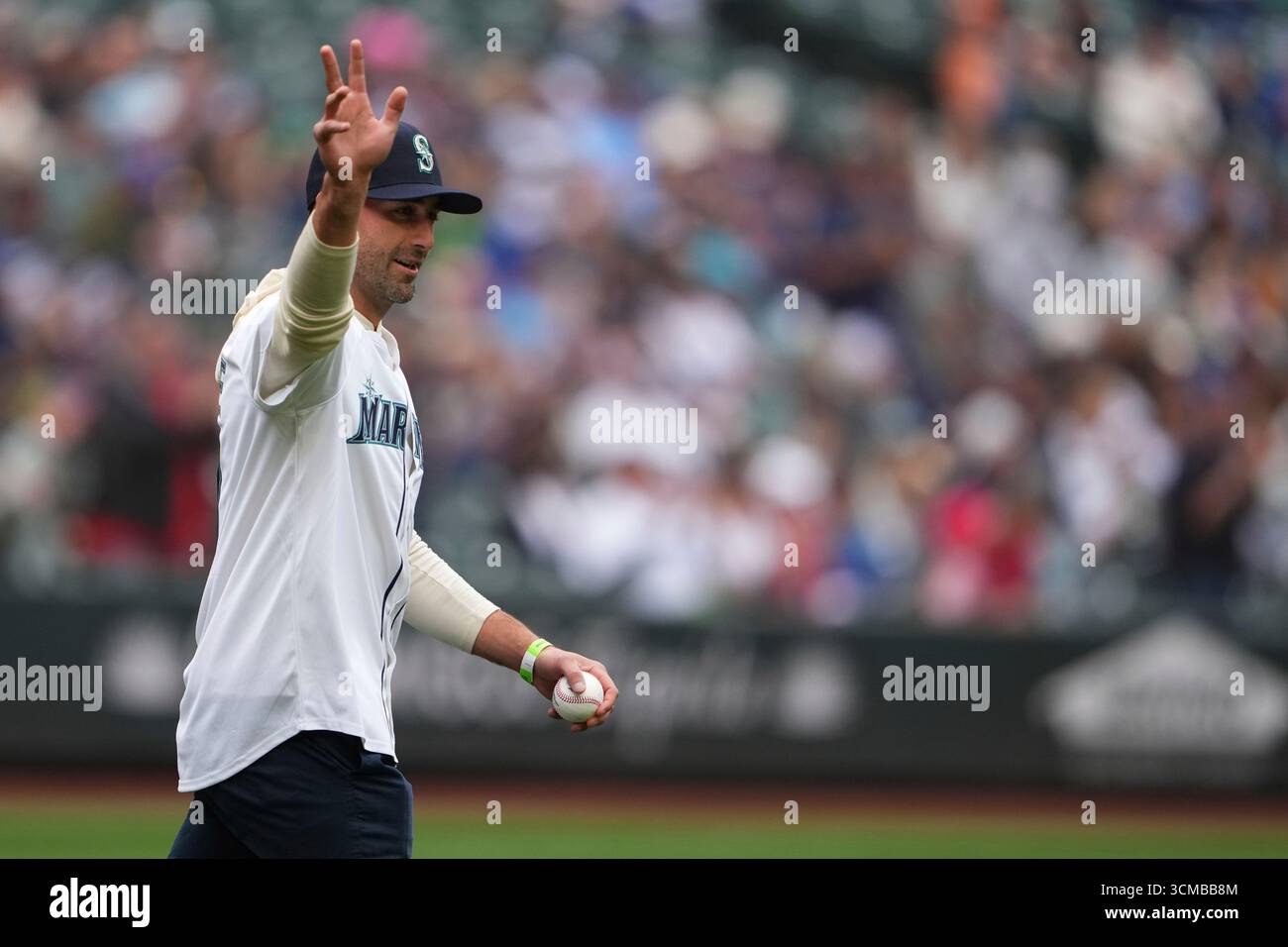 Seattle Kraken right wing Jordan Eberle waves before throwing the ...