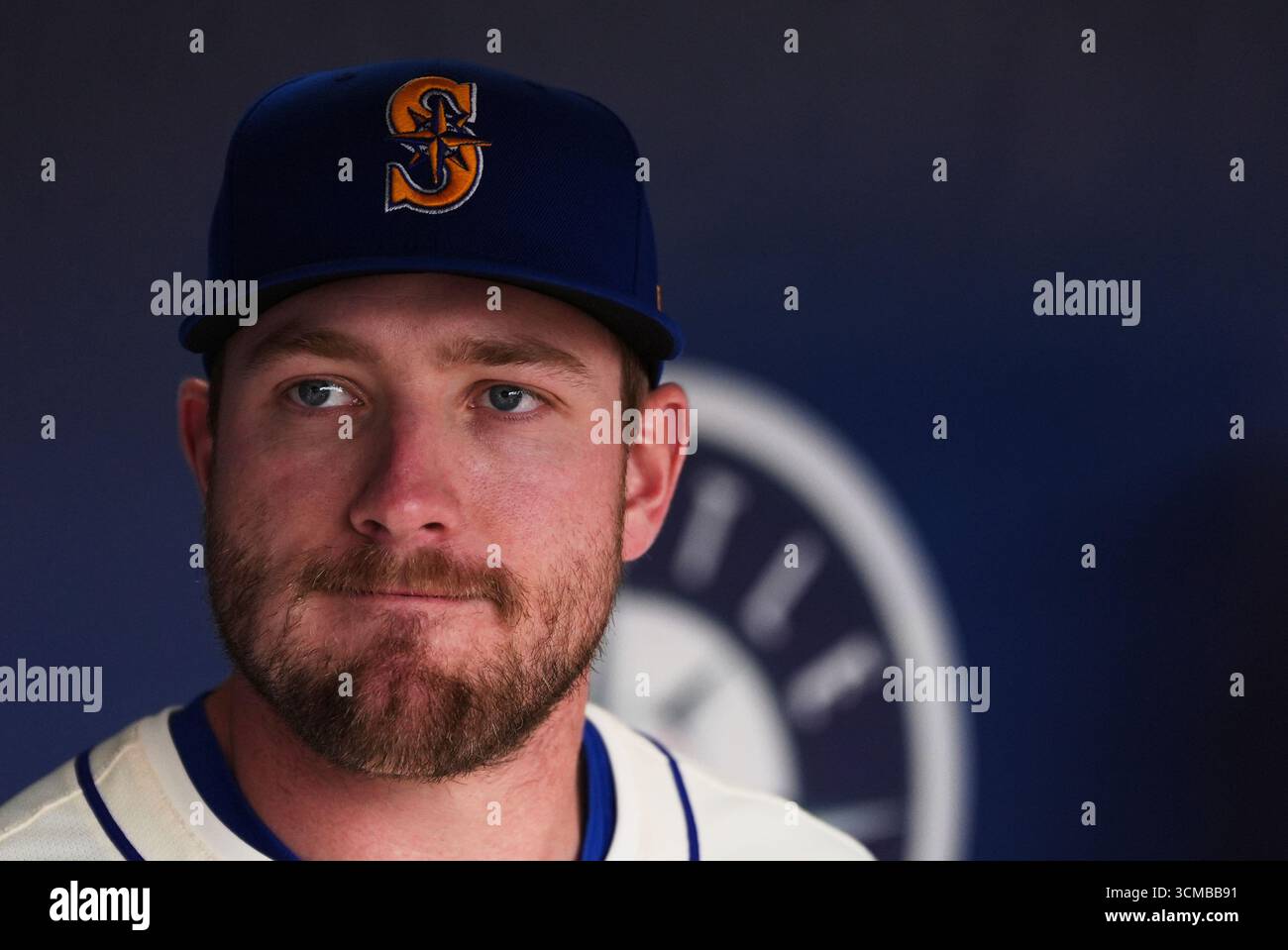 Seattle Mariners right fielder Luke Raley stands in the dugout before a ...