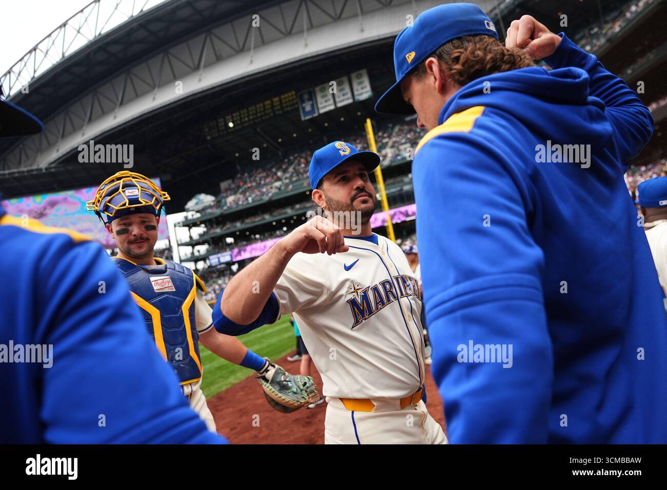 Seattle Mariners catcher Cal Raleigh, left and third baseman Eugenio ...