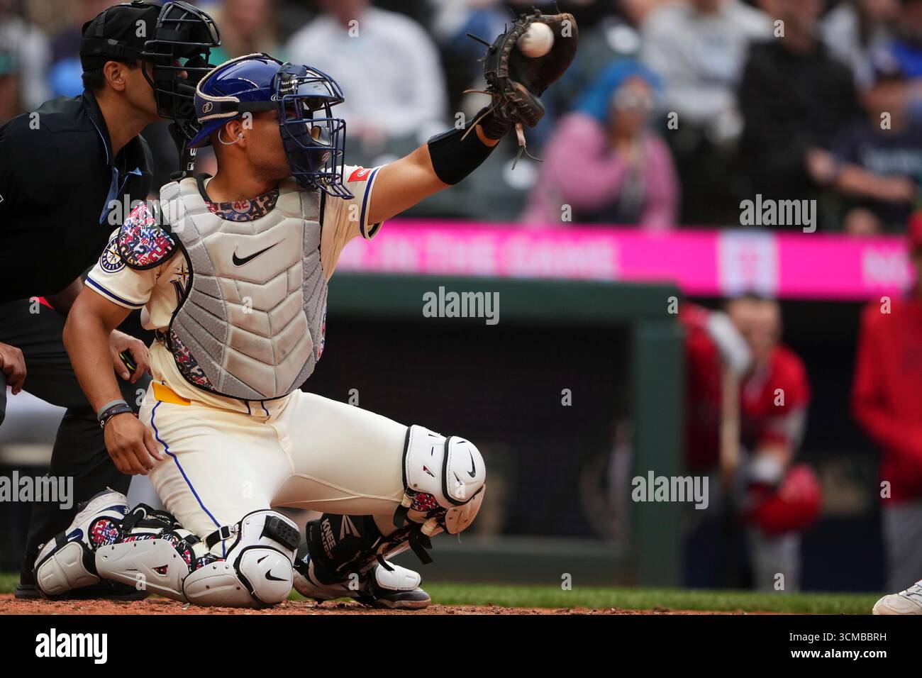 Seattle Mariners catcher Harry Ford catches a ball against the Los ...