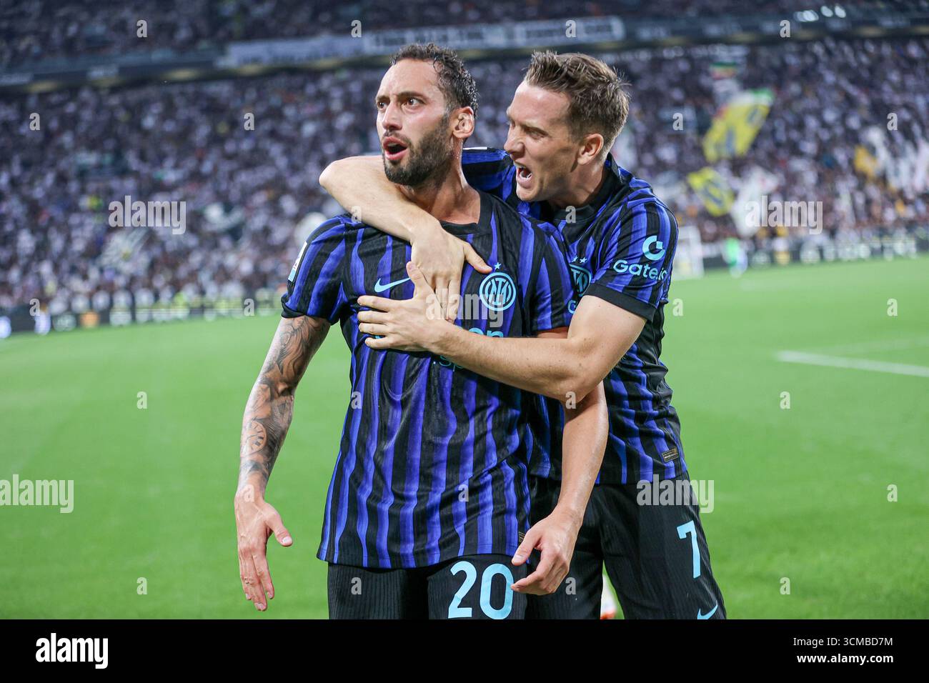 Hakan Calhanoglu (L) and Piotr Zielinski of Inter (R) celebrate a goal ...