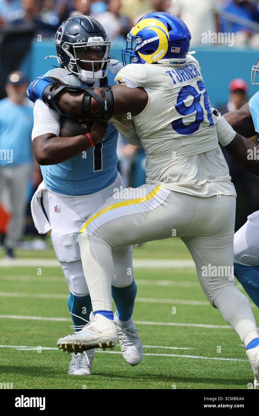 Los Angeles Rams defensive end Kobie Turner (91) sacks Tennessee Titans ...