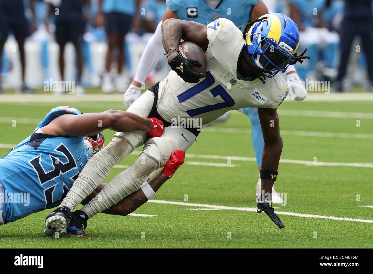 Los Angeles Rams wide receiver Davante Adams (17) is brought down by ...