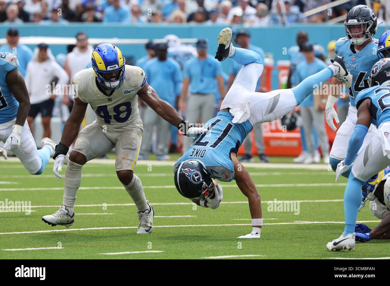 Tennessee Titans wide receiver Chimere Dike (17) flips over during a ...