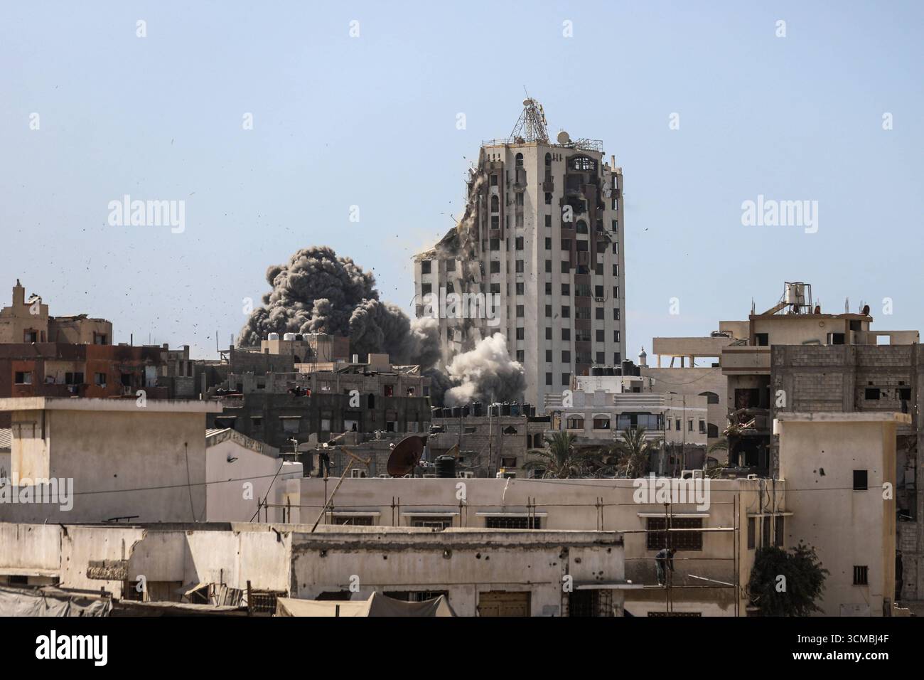 Smoke rises from Al-Ghafri Tower, after it was hit by an Israeli air ...