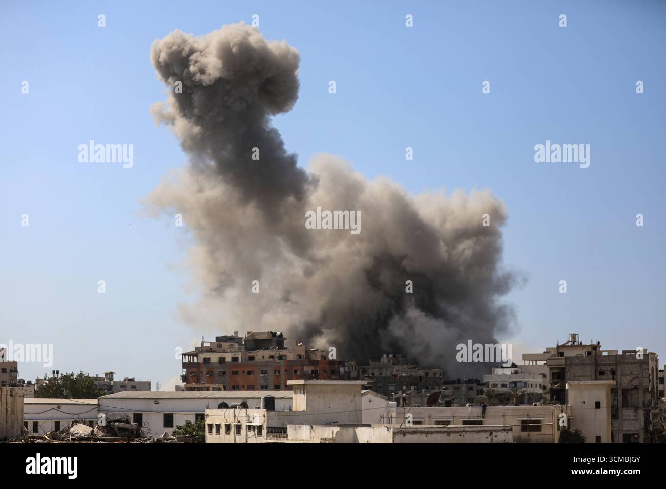 Smoke rises from Al-Ghafri Tower, after it was hit by an Israeli air ...