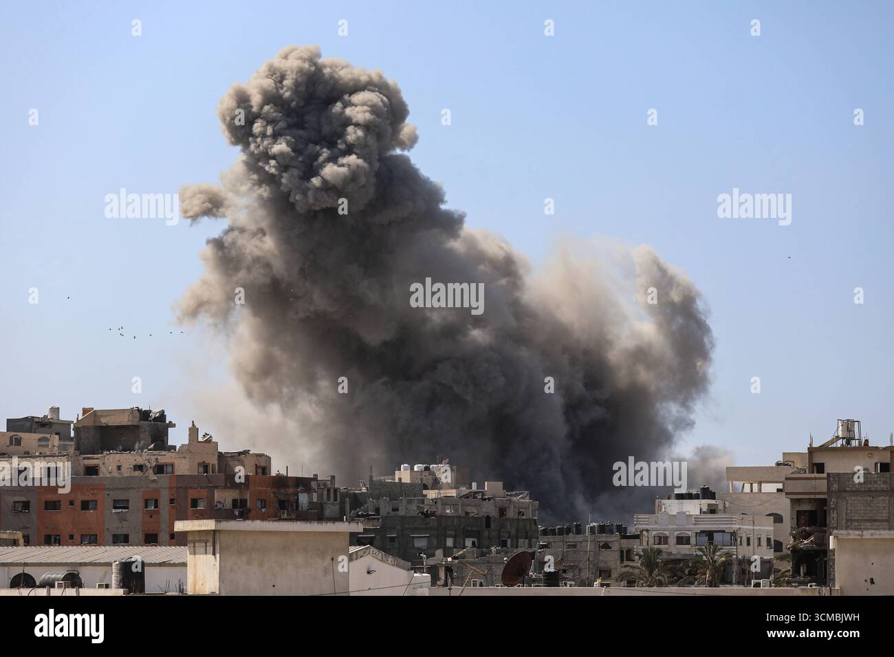 Smoke rises from Al-Ghafri Tower, after it was hit by an Israeli air ...
