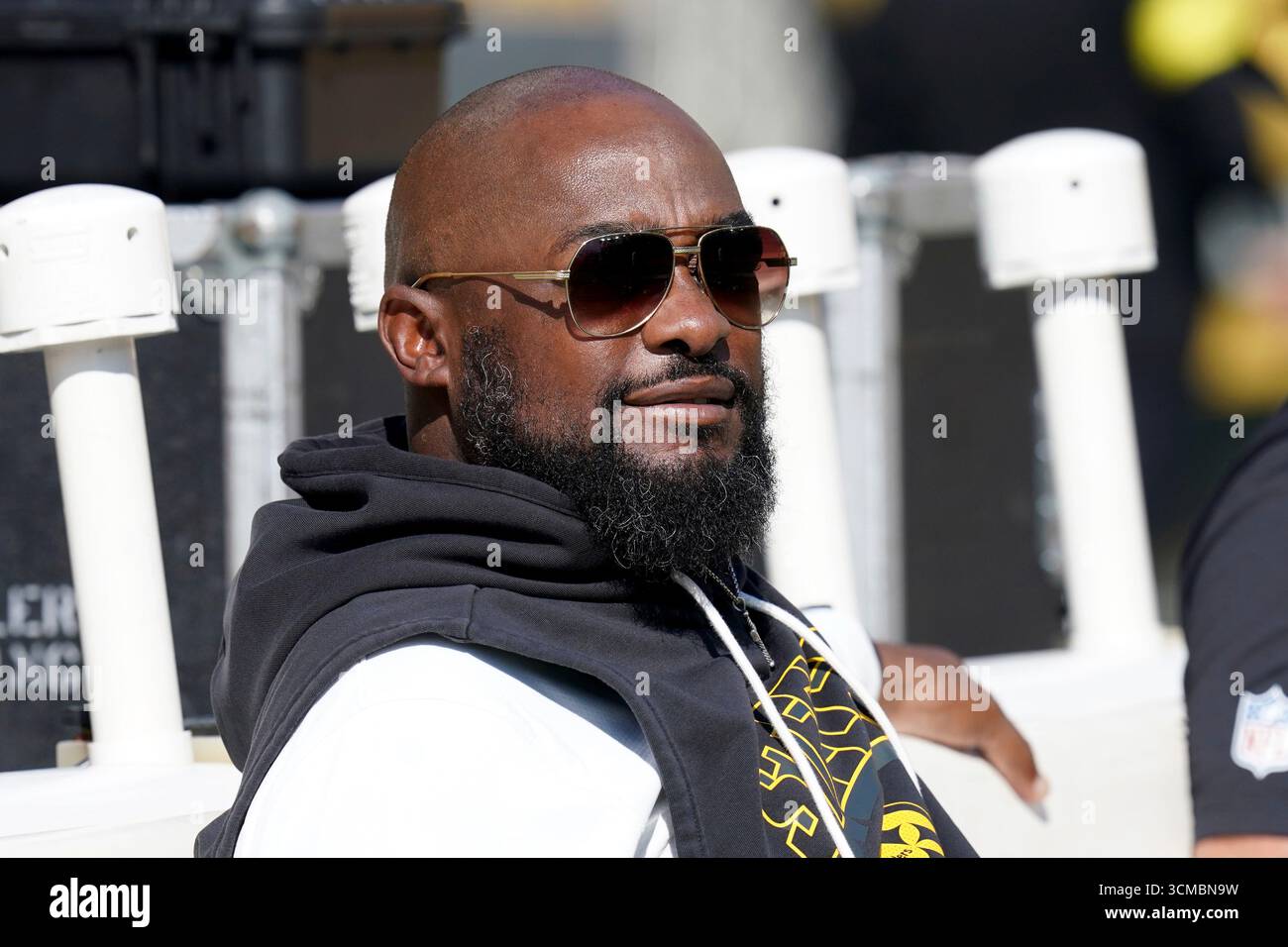 Pittsburgh Steelers head coach Mike Tomlin sits on the bench before an ...