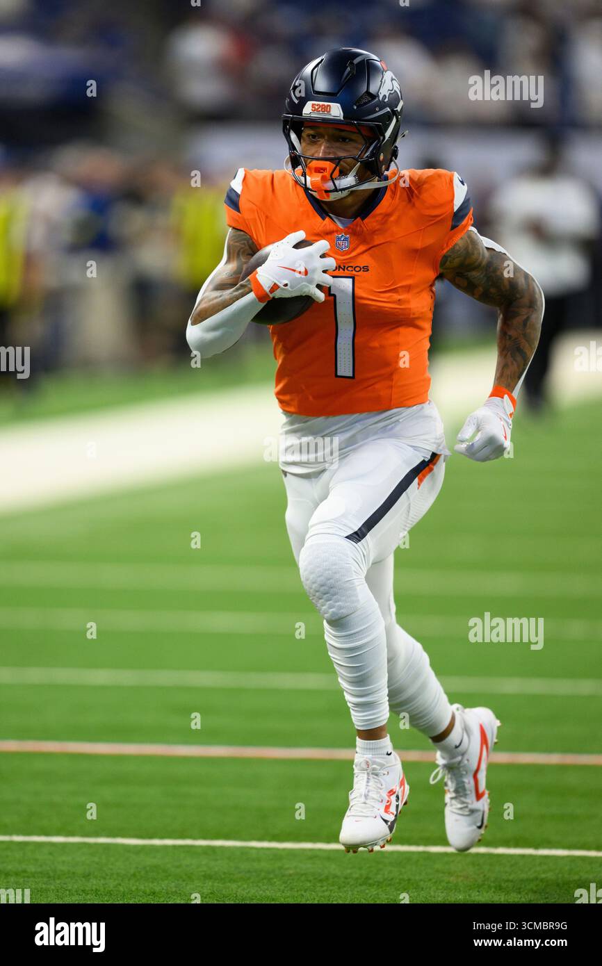 Denver Broncos tight end Evan Engram (1) warms up on the field before ...
