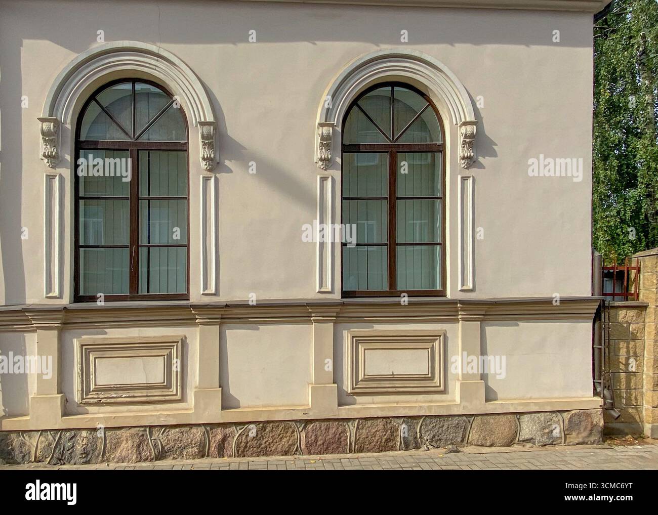 Ornate large arched windows. Great decorated historic building facade ...