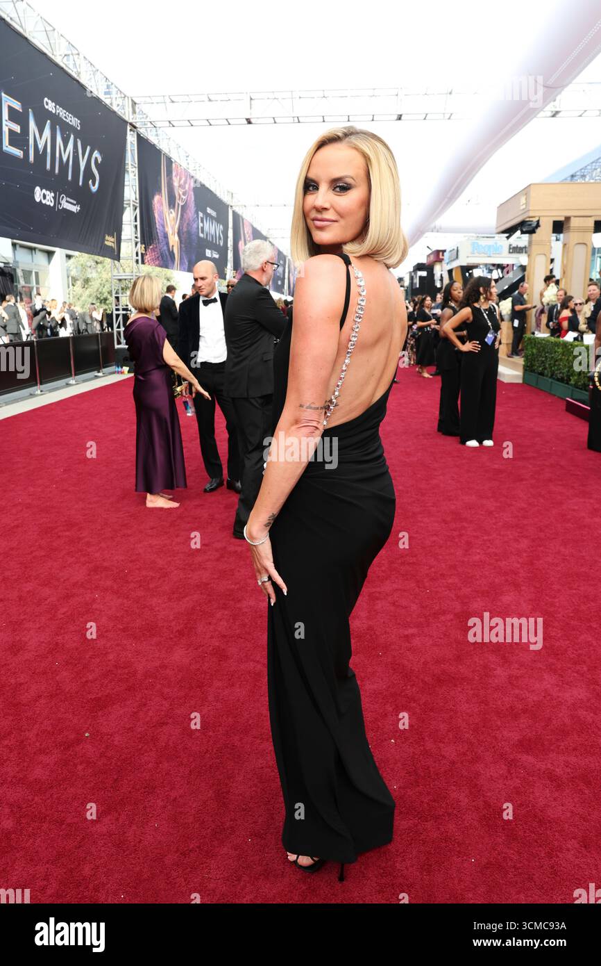 Whitney Rose walks the red carpet at the 77th Emmy Awards on Sunday ...