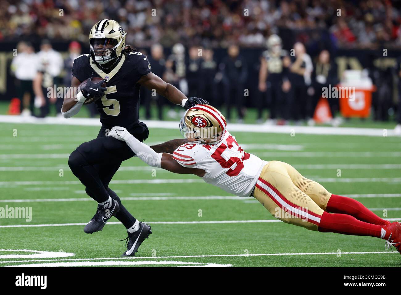 New Orleans Saints running back Kendre Miller (5) tries to get past San ...