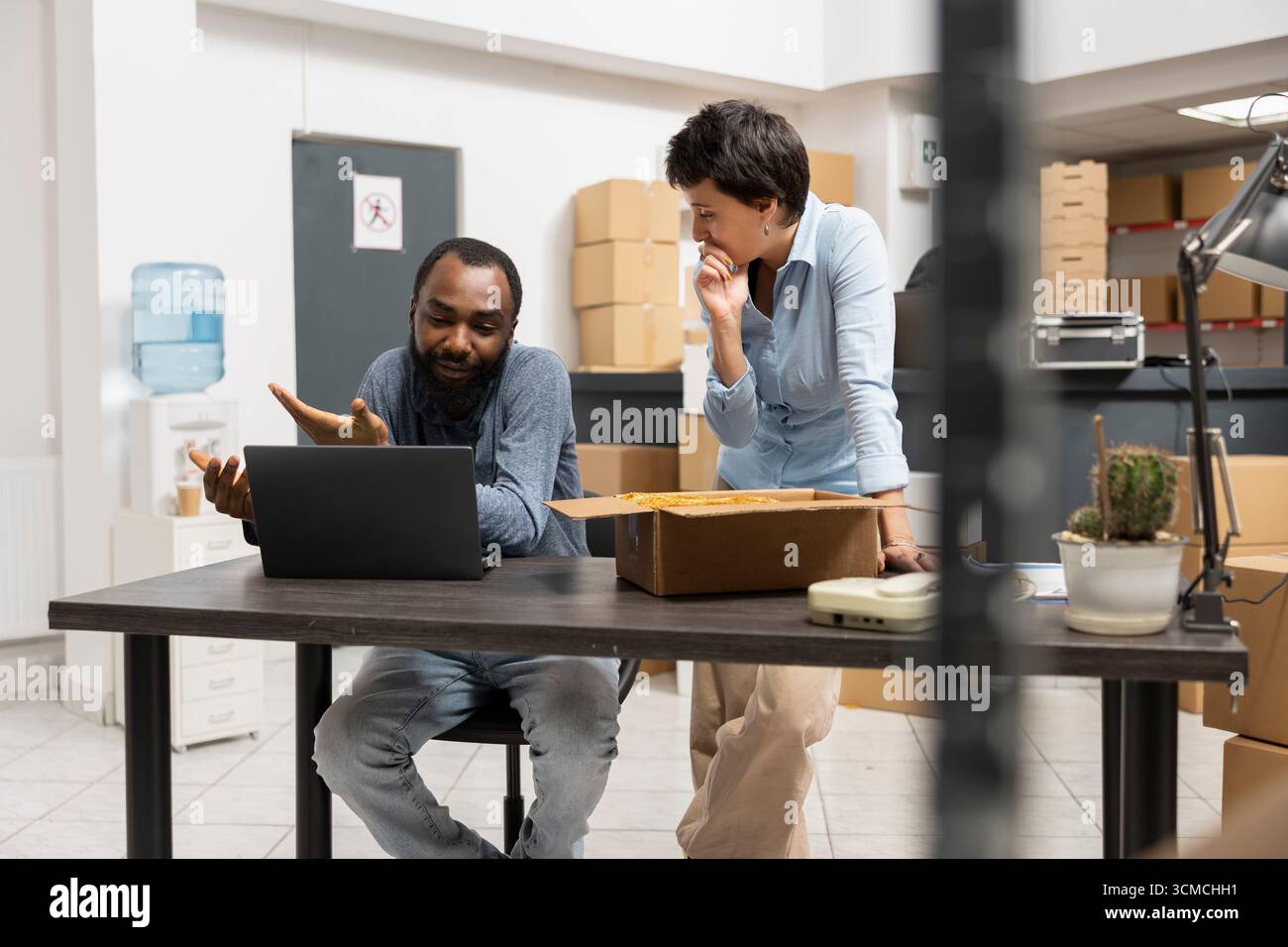 Diverse employees reviewing logistics hi-res stock photography and ...