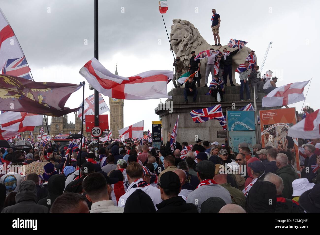 The South Bank Lion looks on as Tommy Robinson supporters head over ...