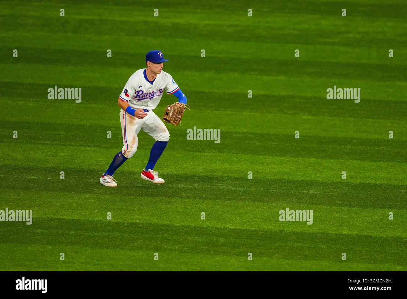 Texas Rangers outfielder Michael Helman fields a single by the ...