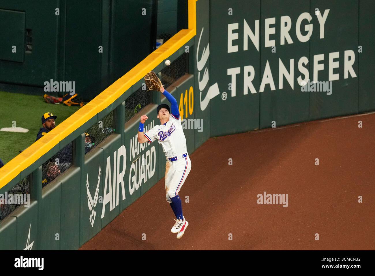 Texas Rangers outfielder Michael Helman robs a home run attempt by ...