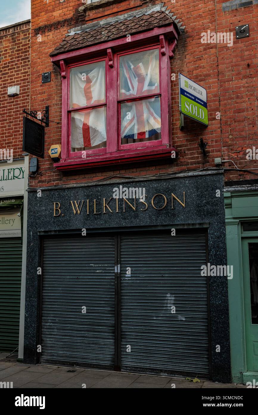 A St George's Cross and a Union Jack are pictured in the window of a ...