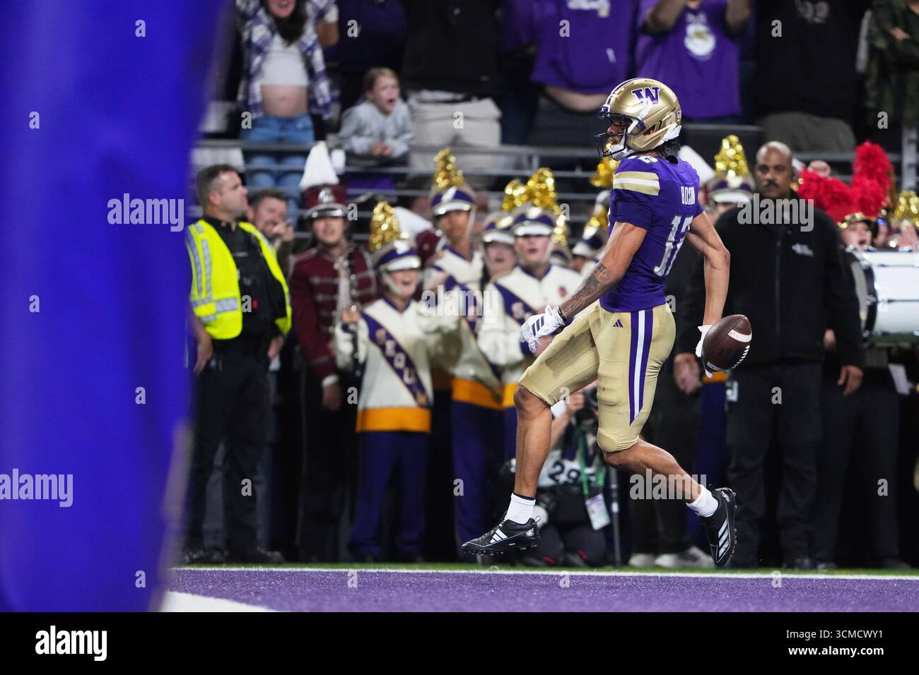 Washington wide receiver Denzel Boston scores a touchdown against UC ...