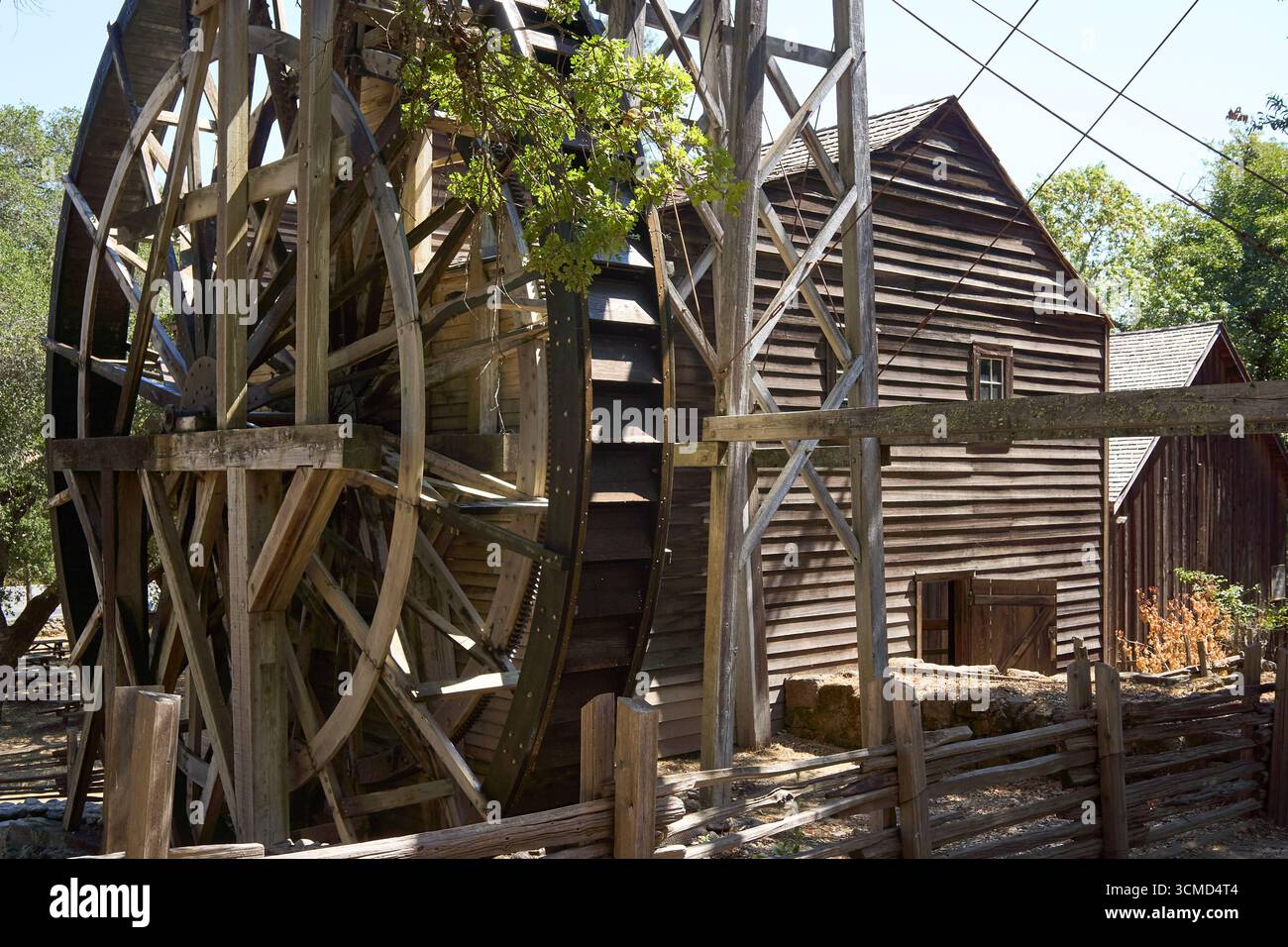 Flour Mill exterior with emphasis on the water wheel at Bale Grist Mill ...