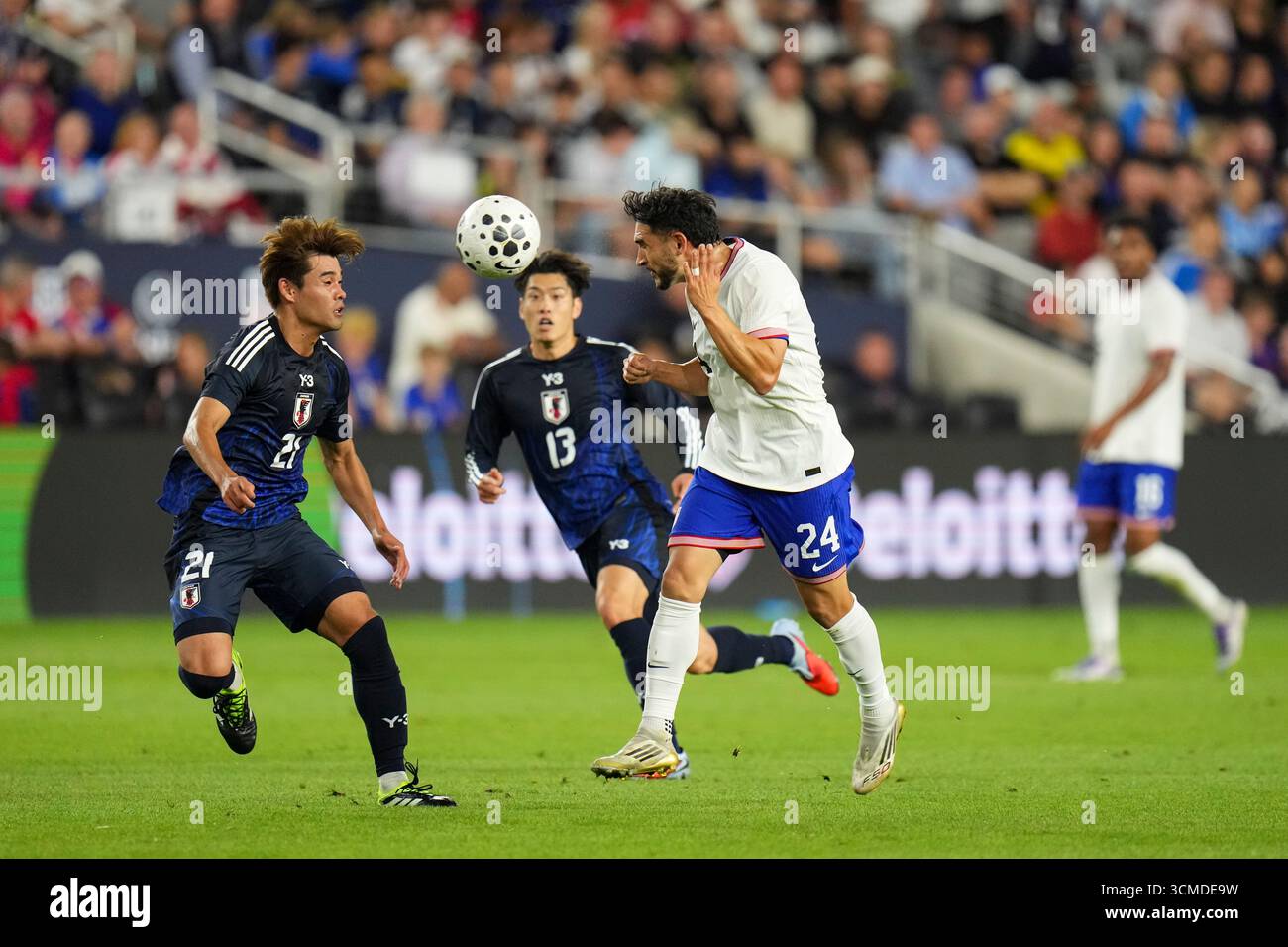 United States' Cristian Roldan (24) heads the ball against Japan Yuito ...
