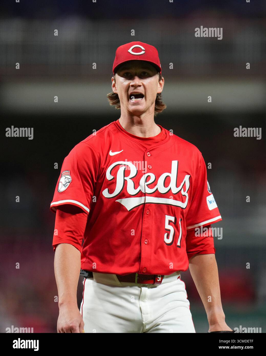 Cincinnati Reds pitcher Brady Singer reacts after striking out New York ...