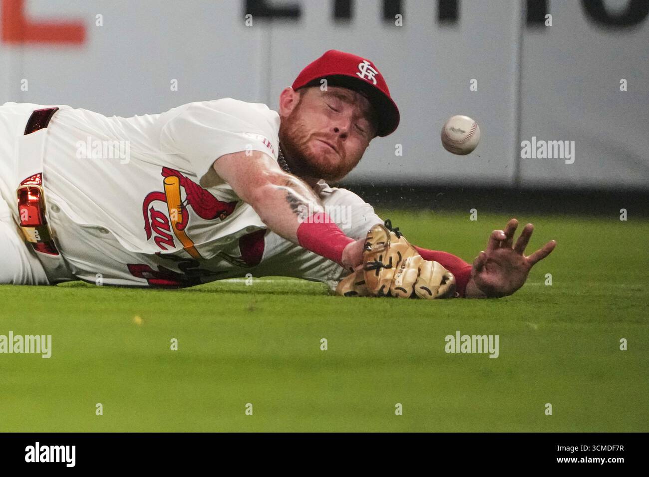 St. Louis Cardinals right fielder Nathan Church is unable to catch a ...