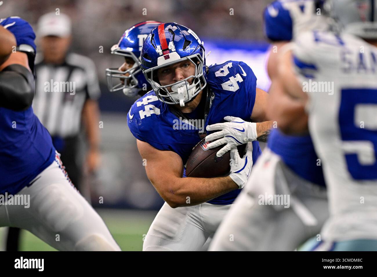 New York Giants running back Cam Skattebo (44) runs with the ball ...