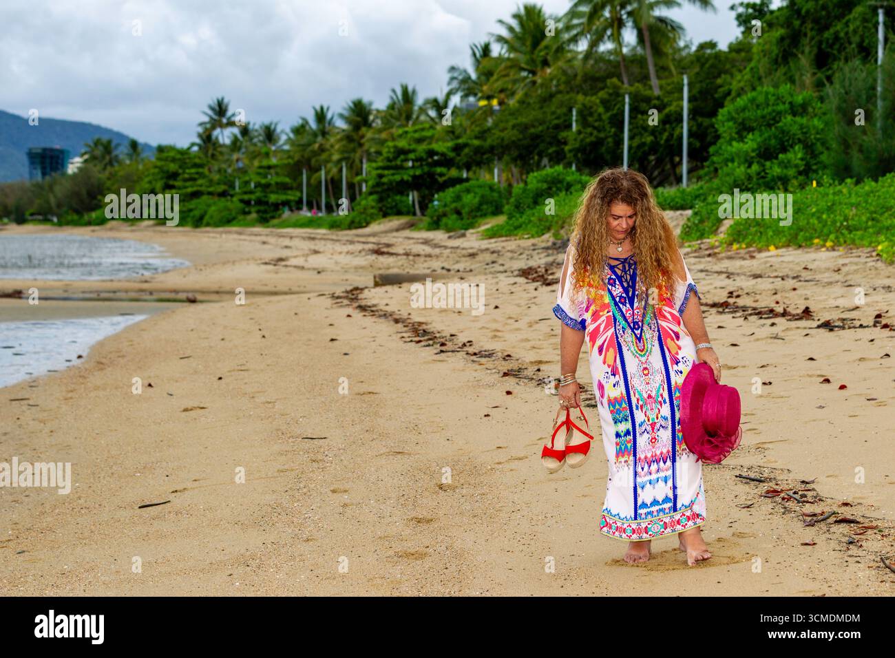walking beach lady thinking toe in sand colour full dress long curly ...