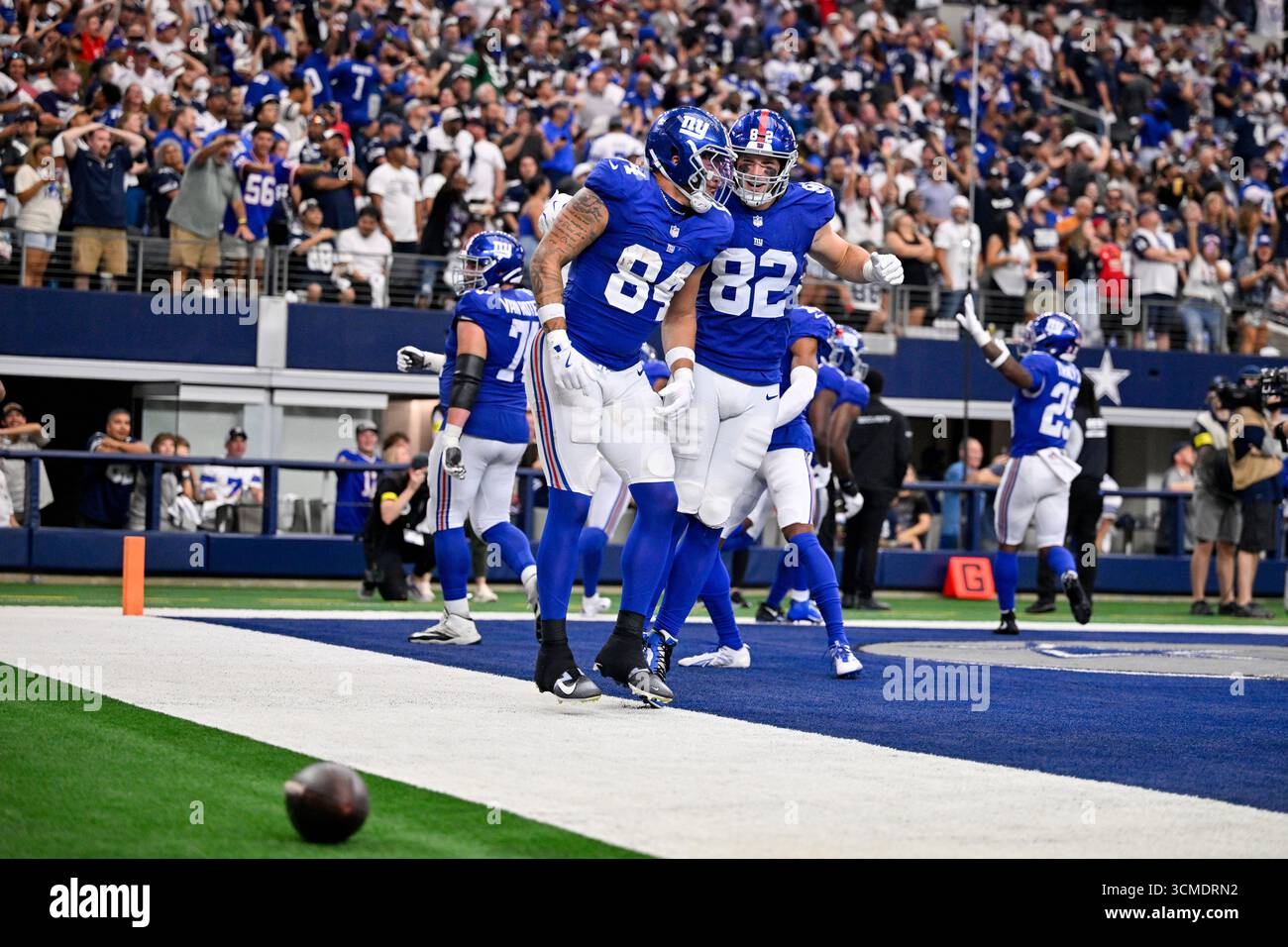New York Giants tight end Theo Johnson (84) and Daniel Bellinger ...