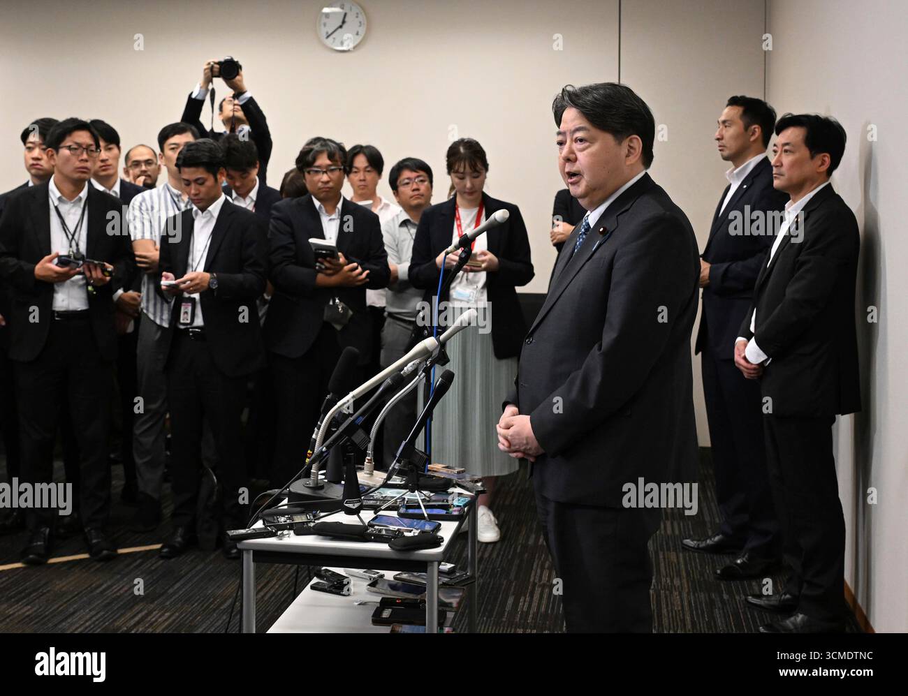 Japanese Chief Cabinet Secretary Yoshimasa Hayashi announces his ...