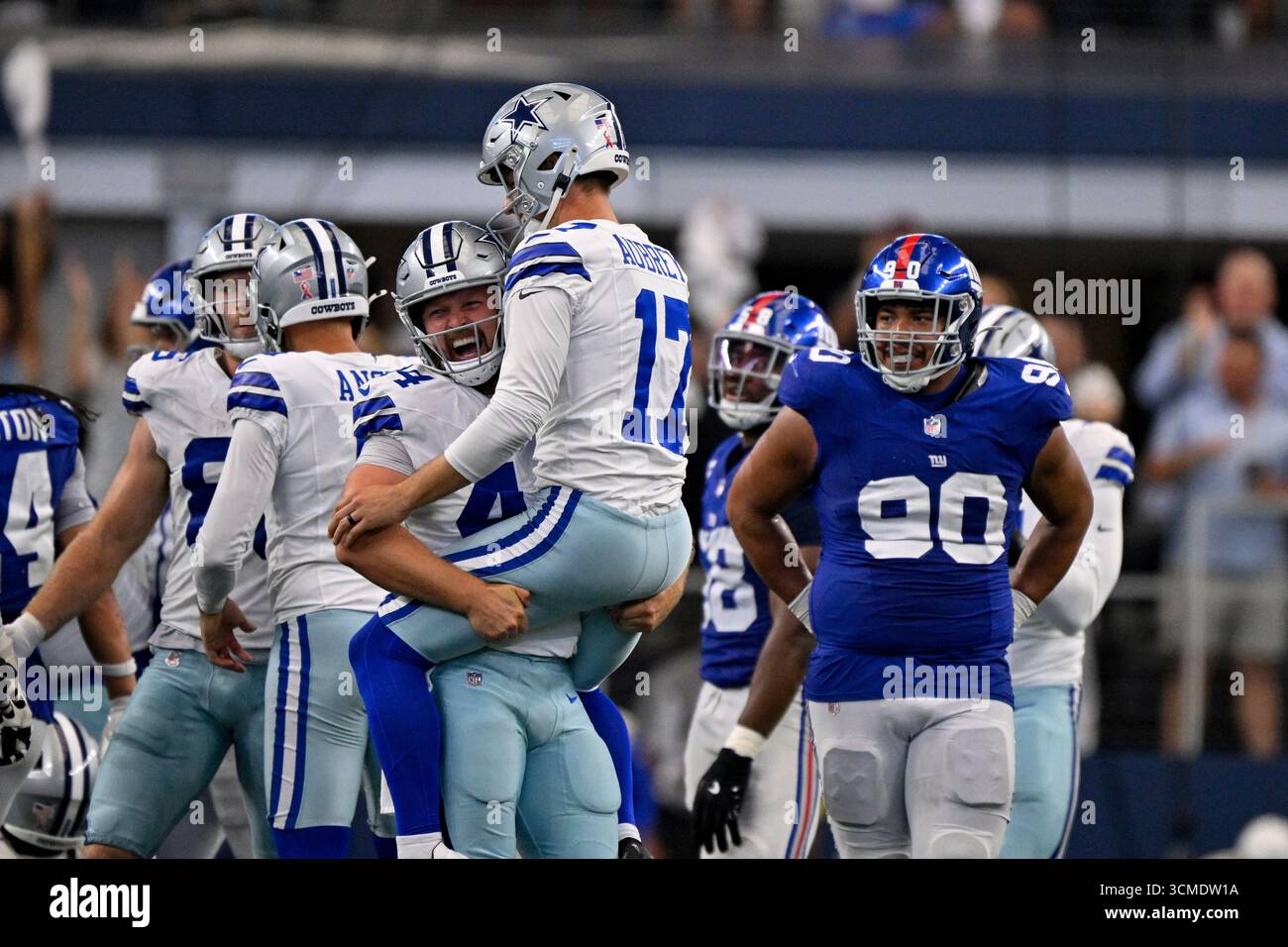 Dallas Cowboys long snapper Trent Sieg (44) celebrates with place ...