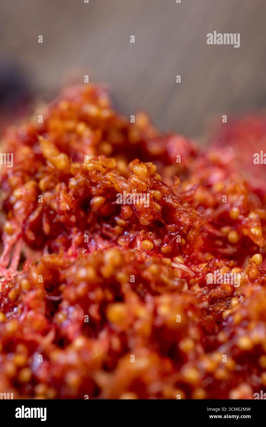 moldy whole overripe and spoiled figs with red flesh and seeds on a ...