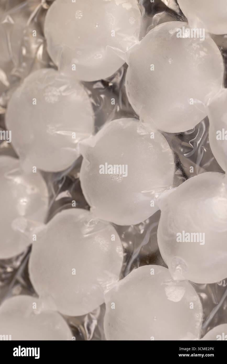 white ice in bags for freezing water close up, frozen water in special ...