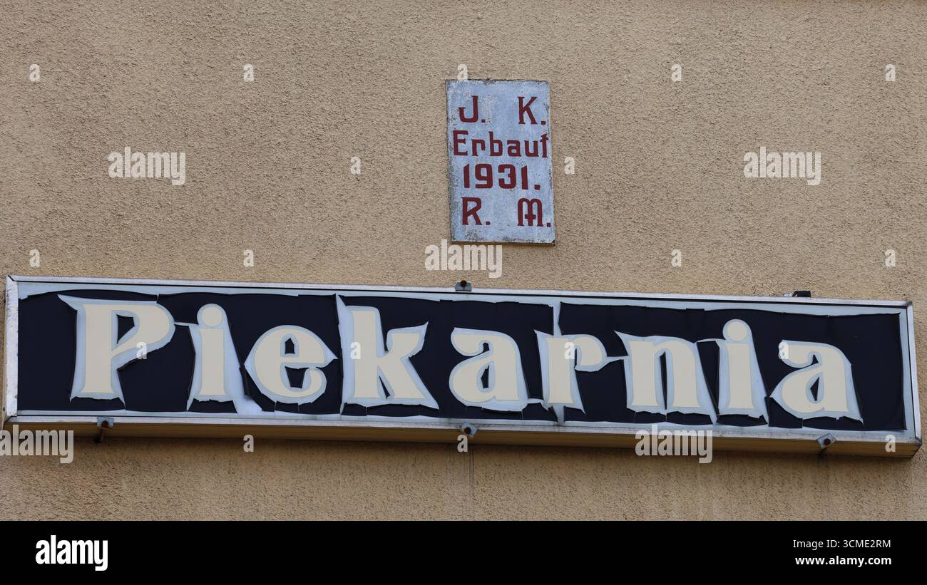 An old Polish bakery sign with a historical plaque from 1931 Stock ...