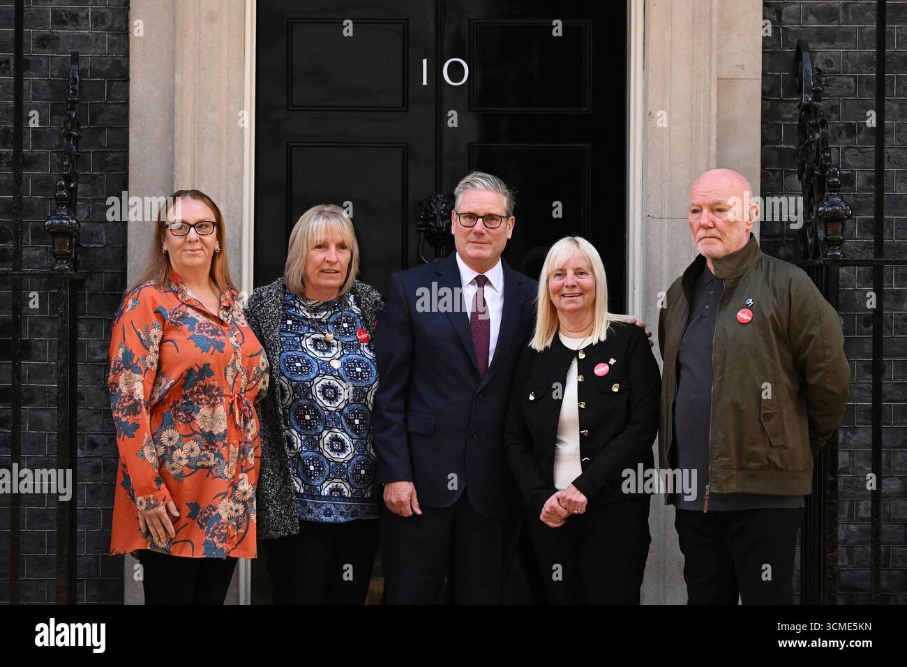 Britain's Prime Minister Keir Starmer, center, meets with Charlotte ...