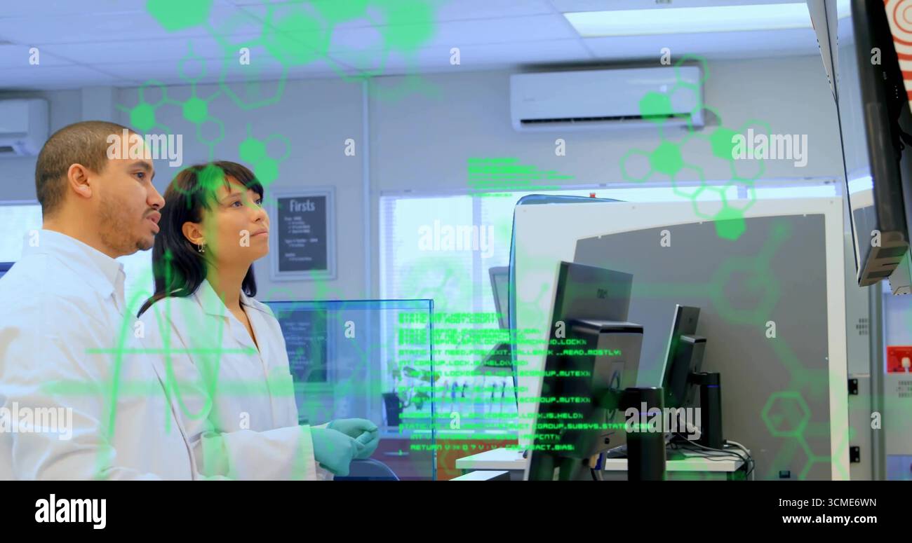 Analyzing researchers wearing lab coats, gloves at lab bench, with ...