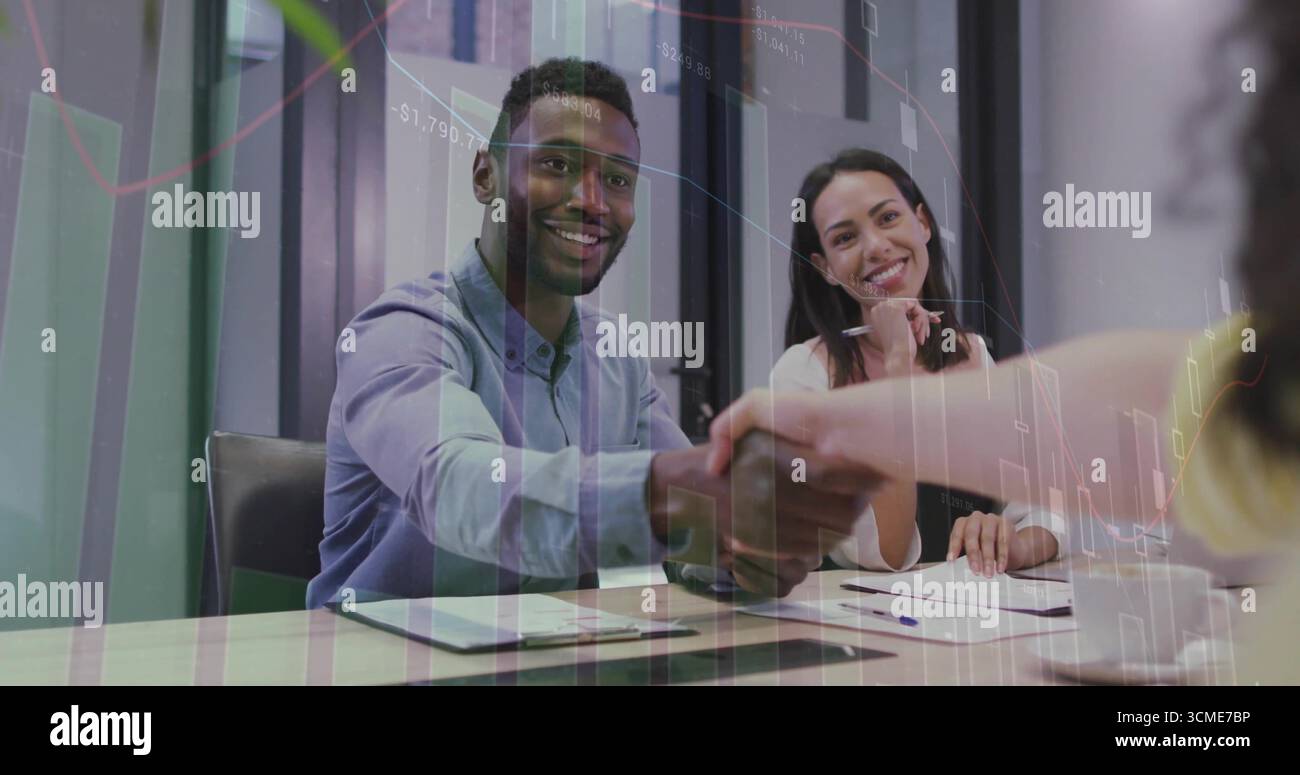 Leaning manager and HR rep exchanging handshake at meeting table with ...